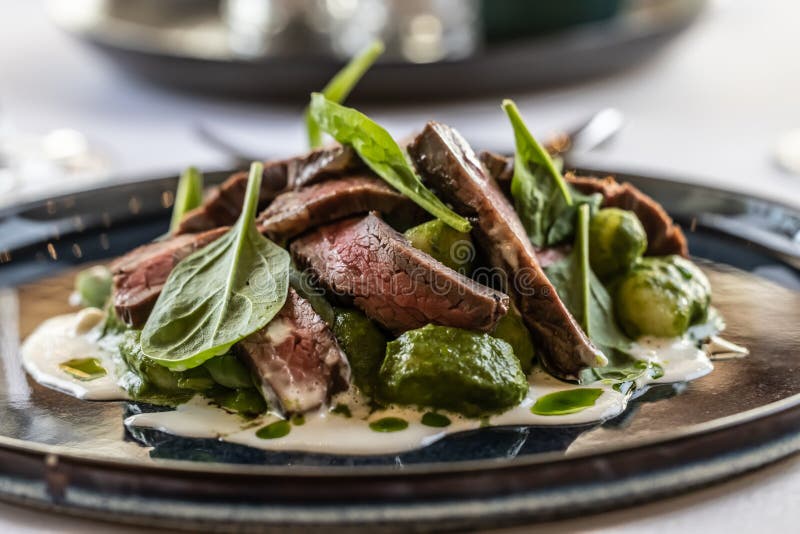 Creatively Cooked Beef Flank Steak with Spinach Gnocchi Served on a ...