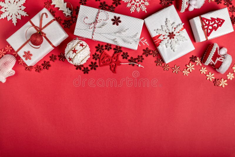 Creatively Wrapped and Decorated Christmas Presents in Boxes on Red ...
