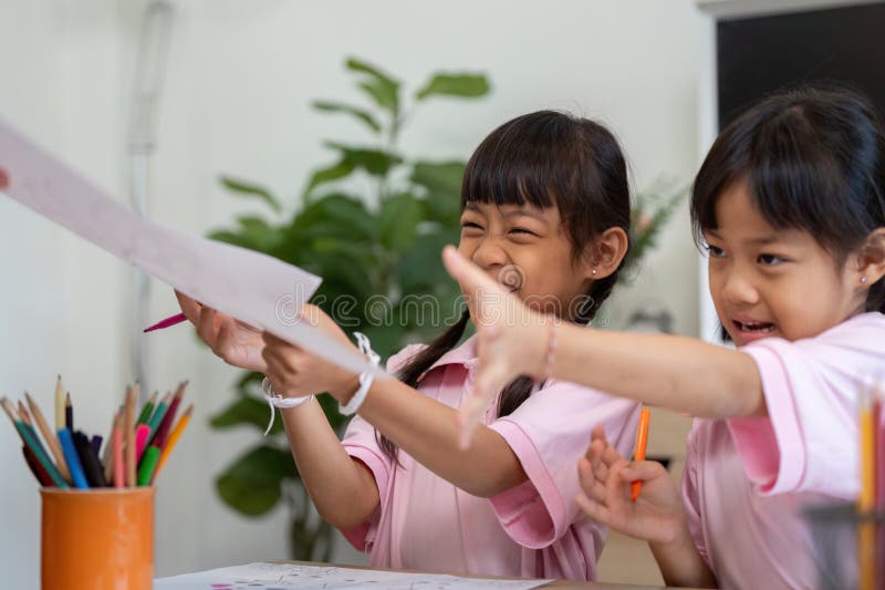 Creativity and Collaboration. Two Girls Excitedly Sharing Their Artwork ...