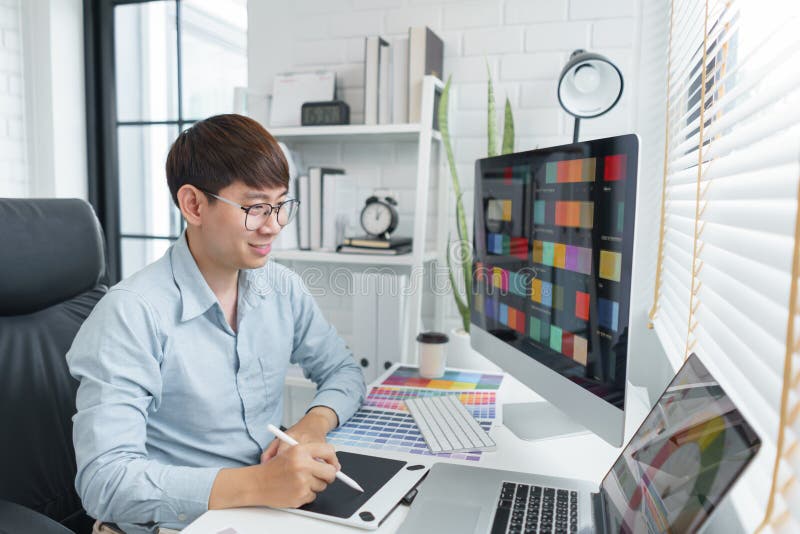 Creativity Concept, Male Graphic Designer Using Tablet and Looking ...