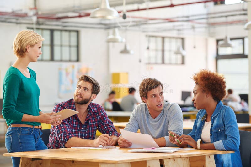 Creativity in Process. a Group of Colleagues Collaborating with Each ...