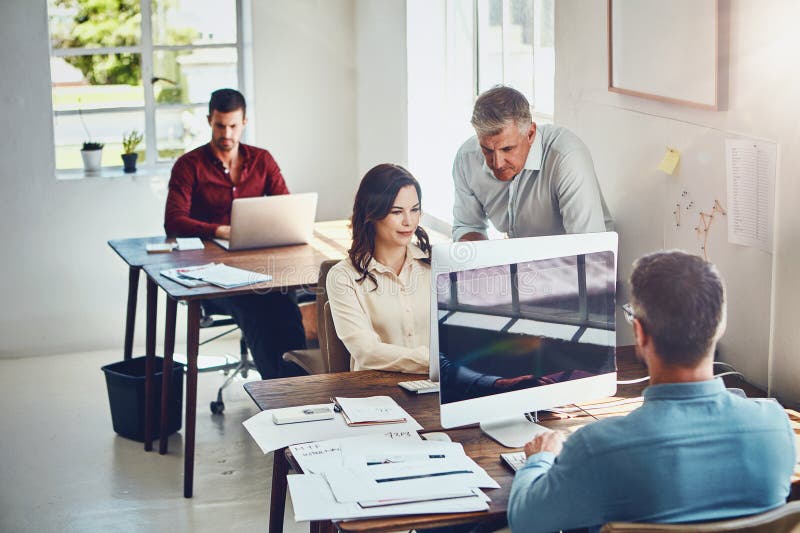 Creativity in Progress. a Group of Colleagues Working in Their Creative ...