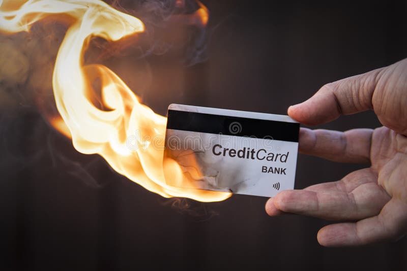 Credit Card in Hand is on Fire. Destruction of Card Payment ...
