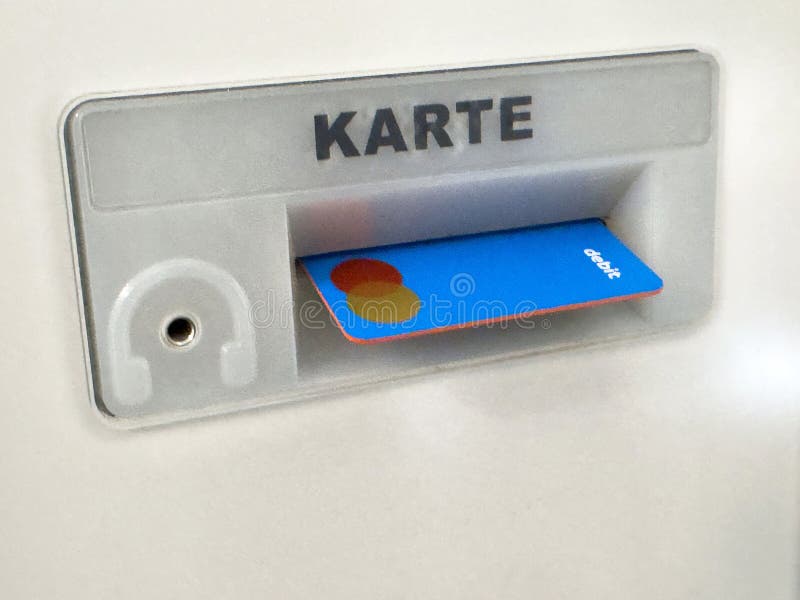 Credit Card Inserted in Austria Atm Slot with Mastercard Logo Editorial ...