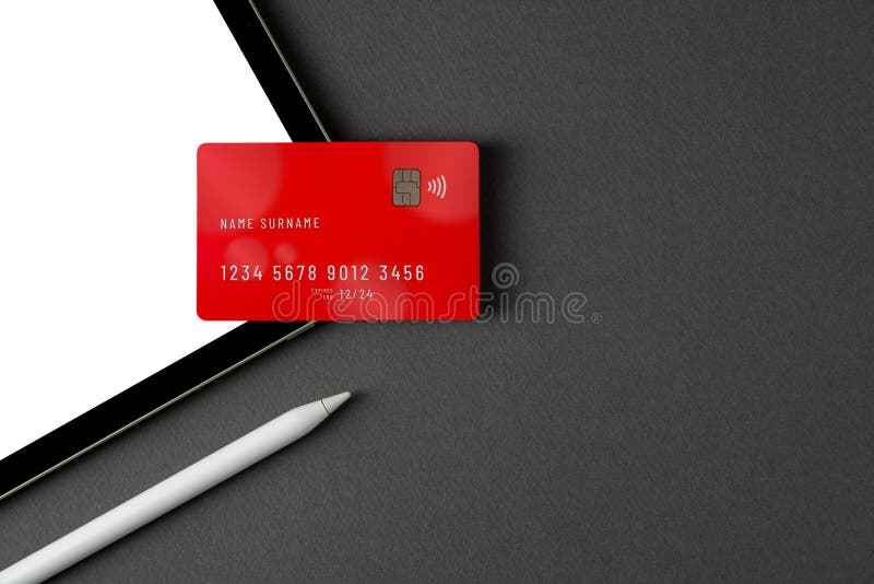 Credit Card Lying on Tablet with Blank Screen on Dark Gray Table Stock ...