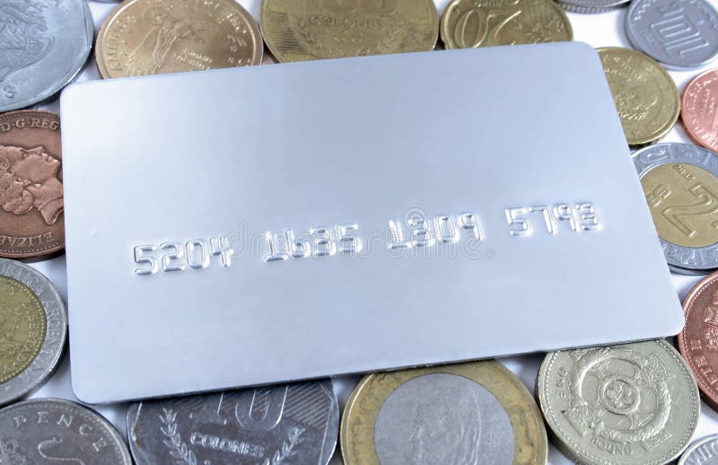 Credit card over coins stock photo. Image of financial - 1431054