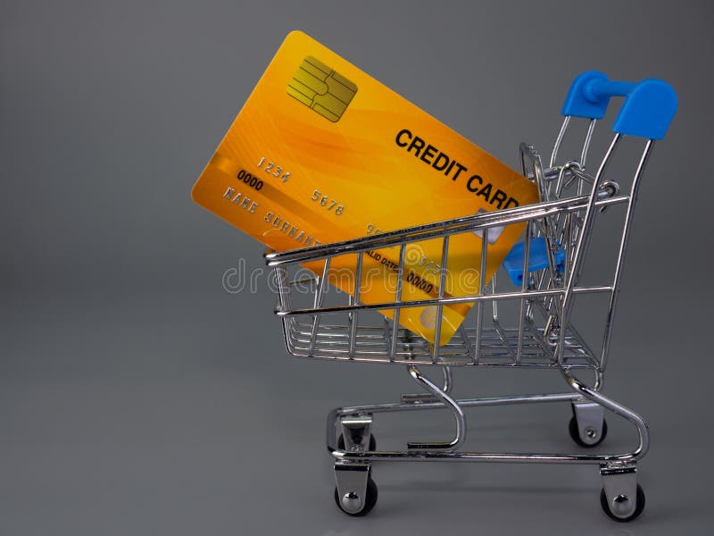 Credit Card and Shopping Cart Stock Photo - Image of currency, debit ...