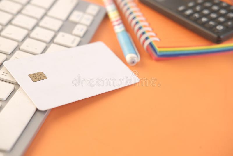 Credit Cards, Keyboard and Notepad on Orange Background Stock Image ...