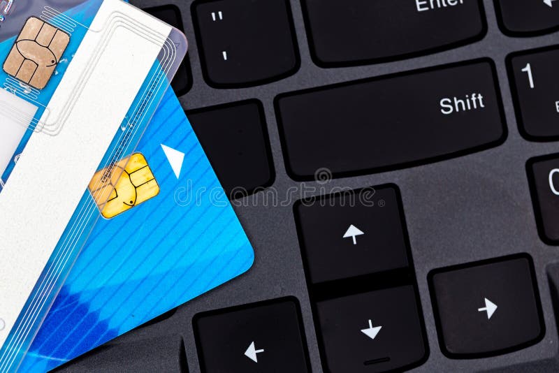 Credit Cards Stacked on a Black Laptop Keyboard. Stock Image - Image of ...