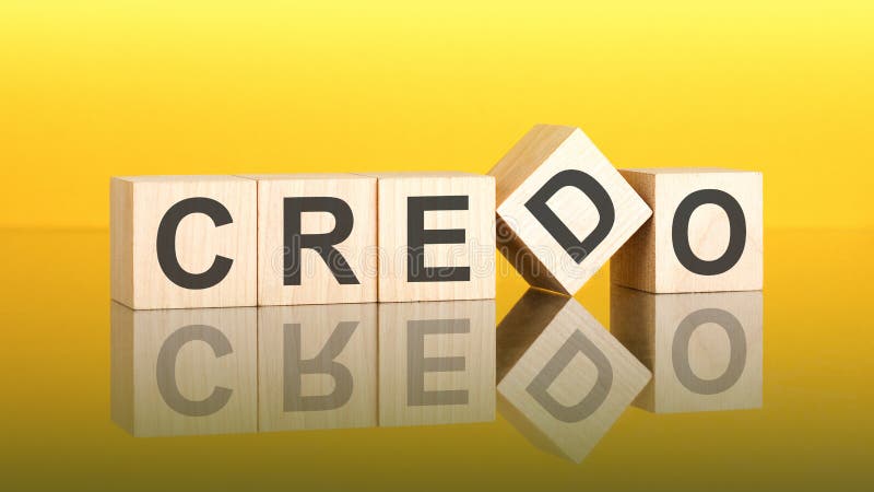 CREDO - Text of on Wooden Cubes, Reflected from the Bright Yellow ...