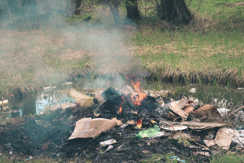 Cremation Plastic Garbage or Trash in Open Fire. Damage To Atmosphere ...
