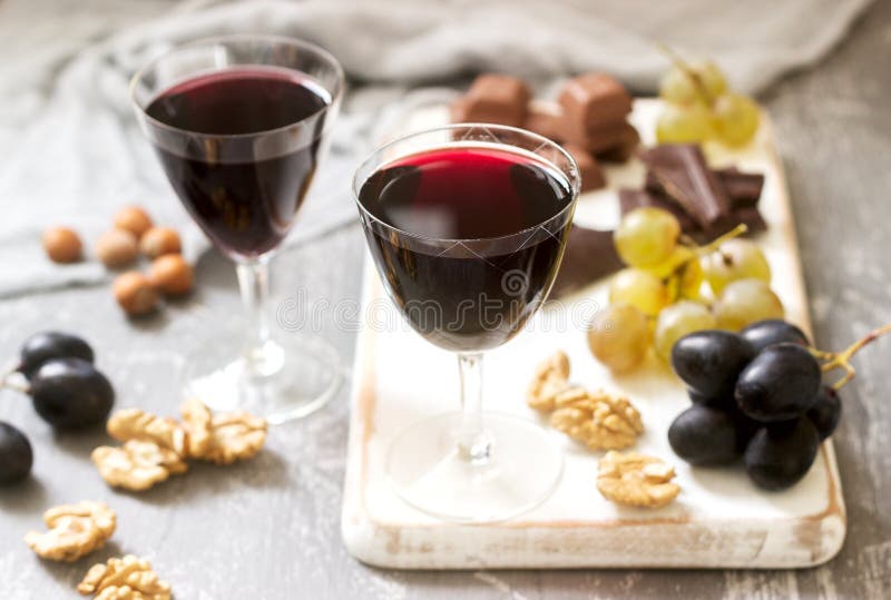 Creme De Cassis Homemade Liqueur Served with Grapes, Nuts and Chocolate ...