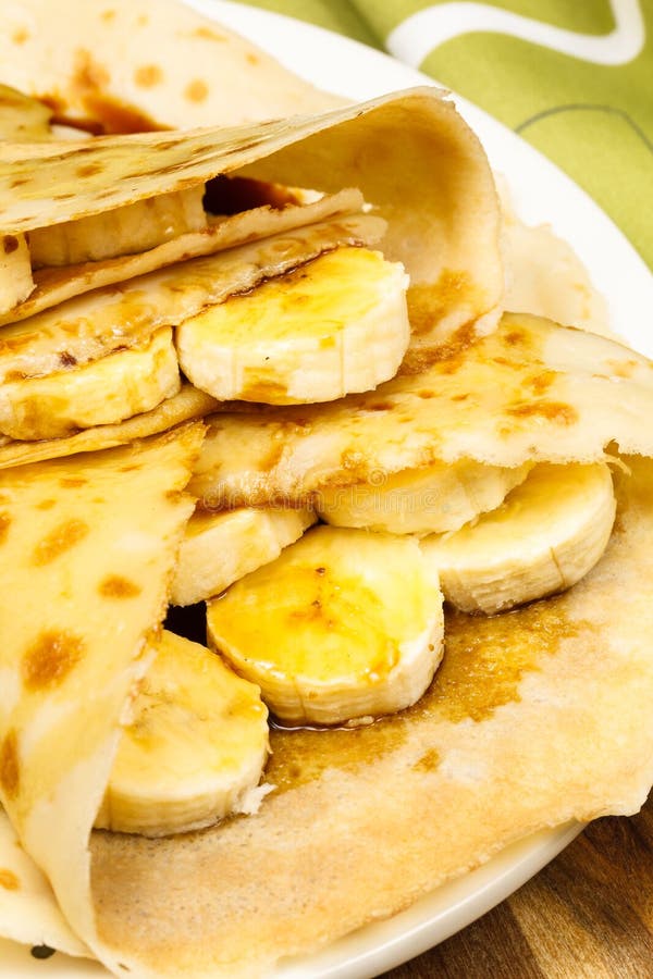 Crepes with Banana, Maple Syrup and Sugar Powder Stock Photo - Image of ...