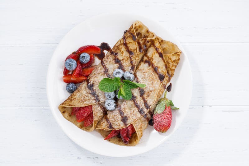 Crepes with Berries and Chocolate Sauce, Top View Stock Photo - Image ...
