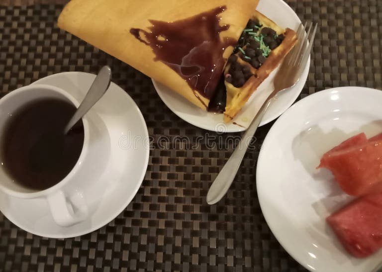 Crepes, Coffee and Pieces of Watermelon are Placed on the Table Stock ...