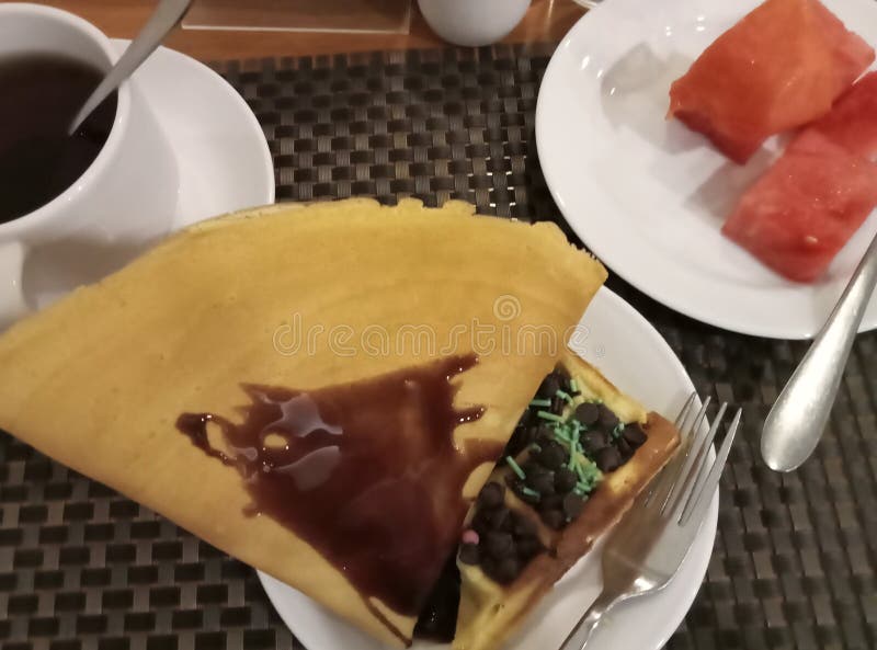 Crepes, Coffee and Watermelon Slices Placed on the Table Stock Photo ...
