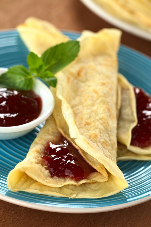Crepes with Strawberry jam stock image. Image of spread - 24920643