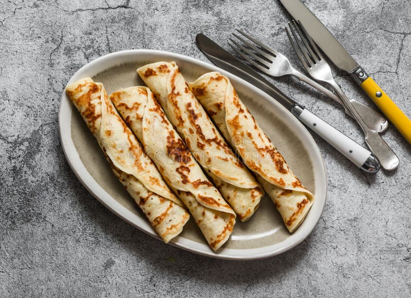 Crepes Stuffed with Tuna, Avocado and Egg on a Grey Background, Top ...