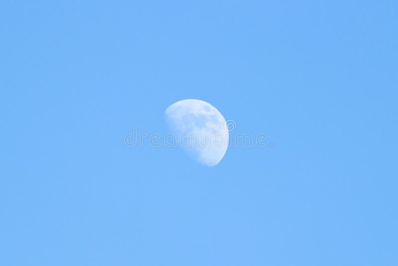 Crescent moon in blue sky stock image. Image of moment - 192786143