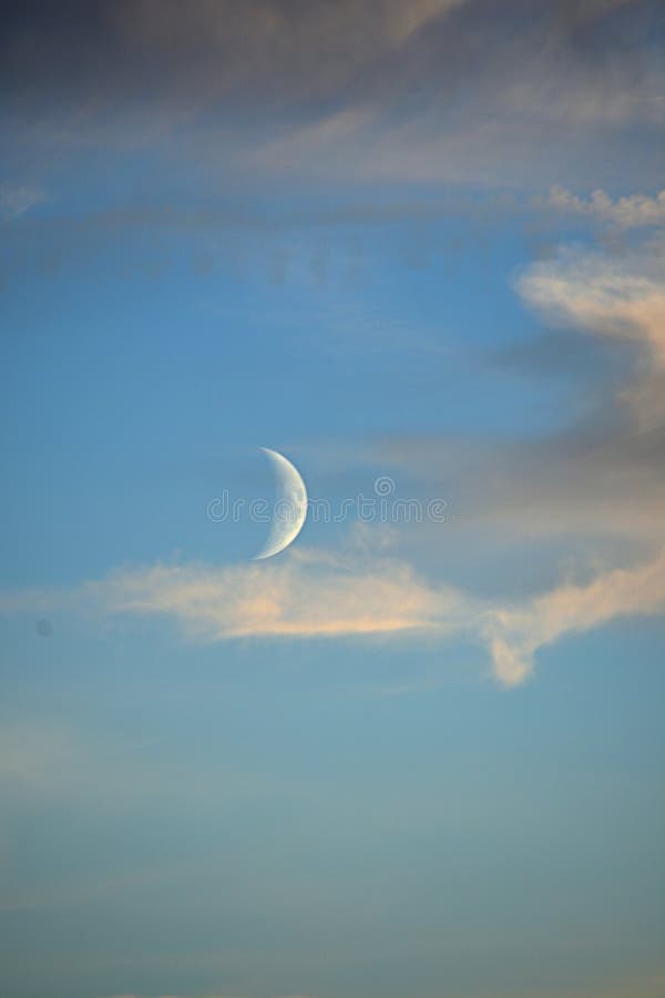 Crescent moon in blue sky stock image. Image of blue - 291084197