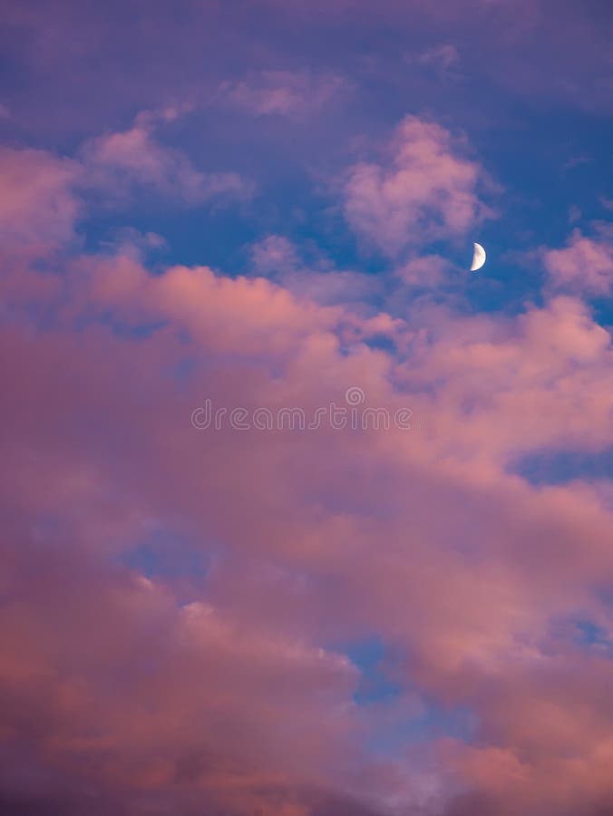 Crescent Moon in a Cloudy Sky with Red Color Clouds at Sunset Stock ...