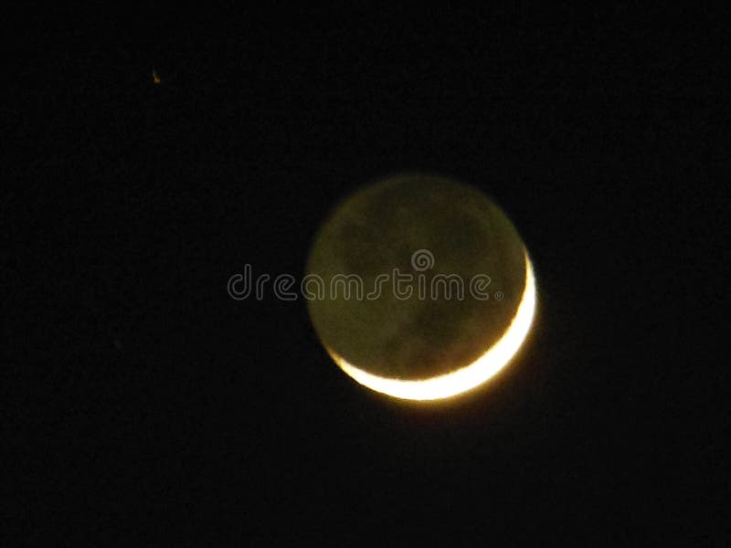Crescent Moon with Glimpse of the Rounded Moon Stock Image - Image of ...