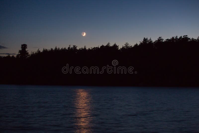 Crescent Moon Over Lake stock photo. Image of moonrise - 78893360