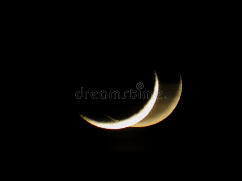 Crescent Moon but Seeing Double in a Dark Night Sky Stock Image - Image ...
