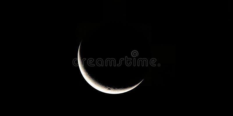 A Crescent Moon Shining Brightly Against a Stark Black Background in ...