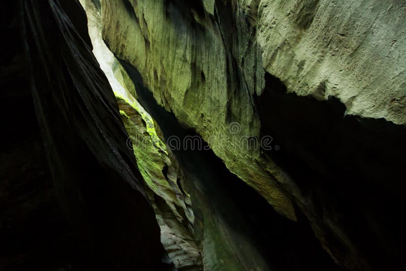 Crevice in Massive Rock with Green Walls Stock Image - Image of shade ...