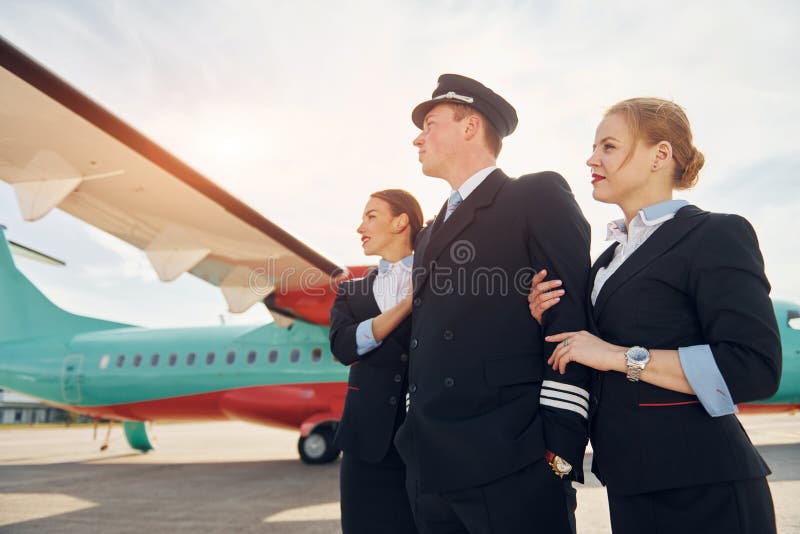 Crew of Airport and Plane Workers in Formal Clothes Standing Outdoors ...