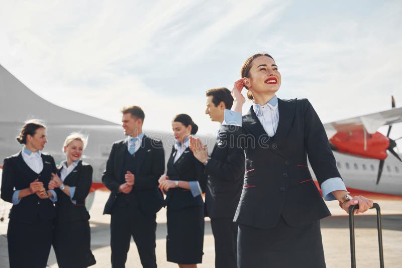 Crew of Airport and Plane Workers in Formal Clothes Standing Outdoors ...