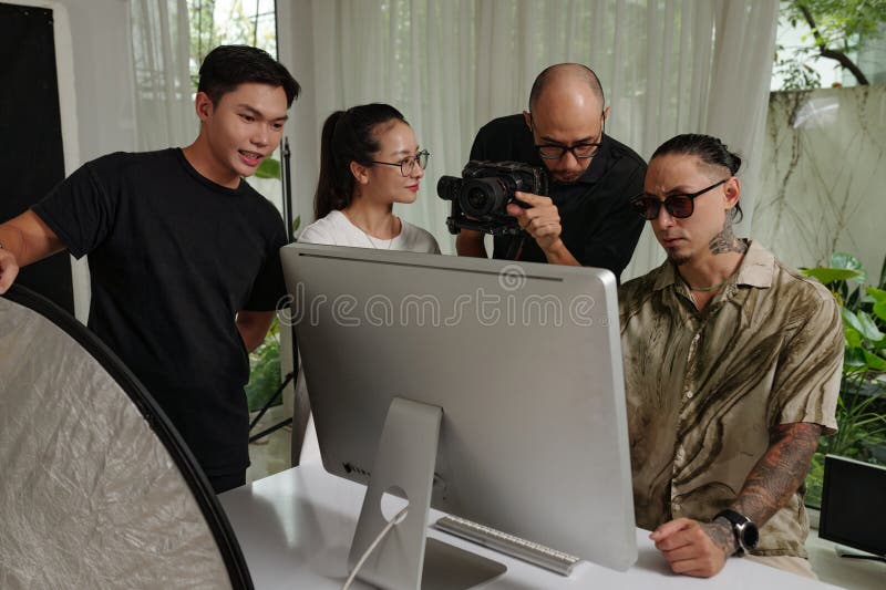 Crew Discussing Plan of Shooting on Computer Stock Photo - Image of backstage, presentation ...