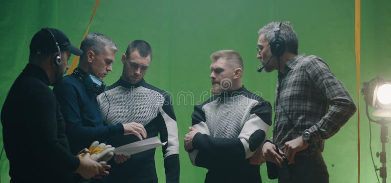 Crew Members Discussing and Actors Getting Ready for Shooting Stock ...