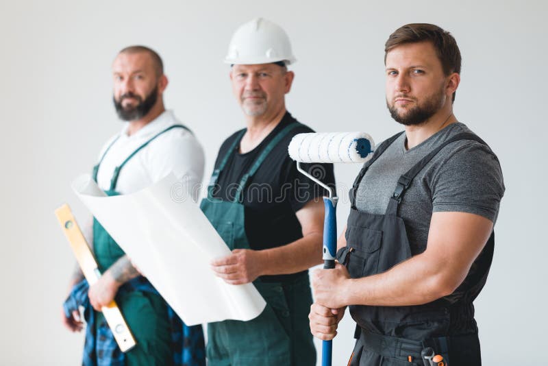 Three builder photos stock image. Image of repairman - 12034561