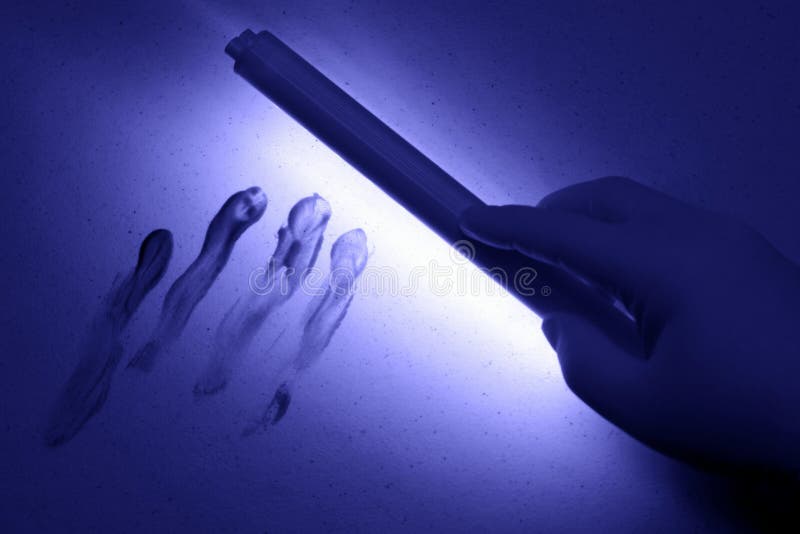 Crime Scene Under UV Black Light Wand in Tech Hand Stock Image - Image ...