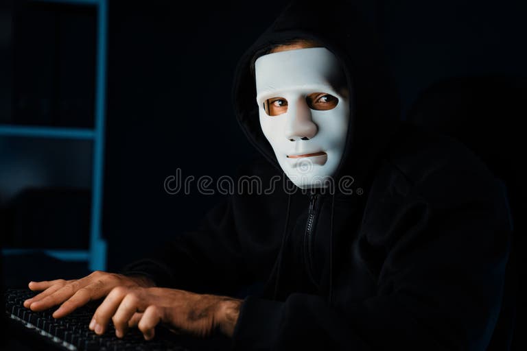 Criminal Anonymous Mask Looking Camera while Install Virus on Keyboard ...