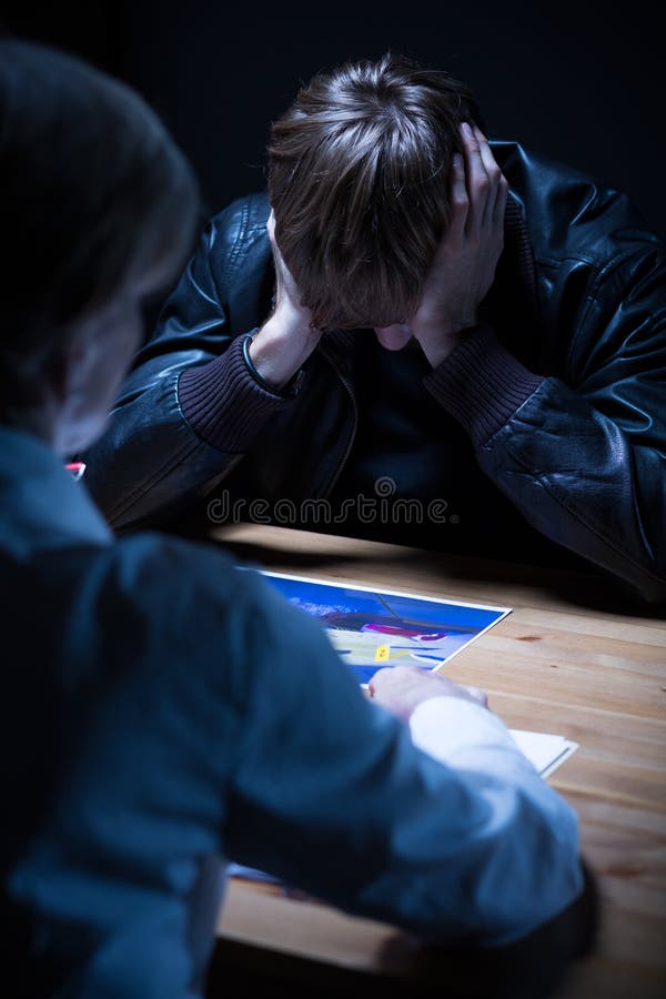 Young Offender Covering Ears Stock Photo - Image of policewoman ...