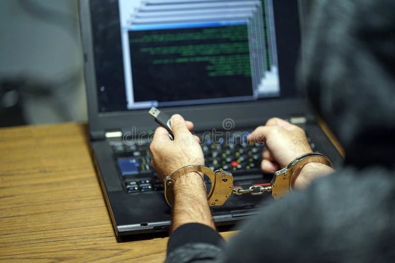Criminal Hacker Hands Locked in Handcuffs. Close-up View Stock Image ...
