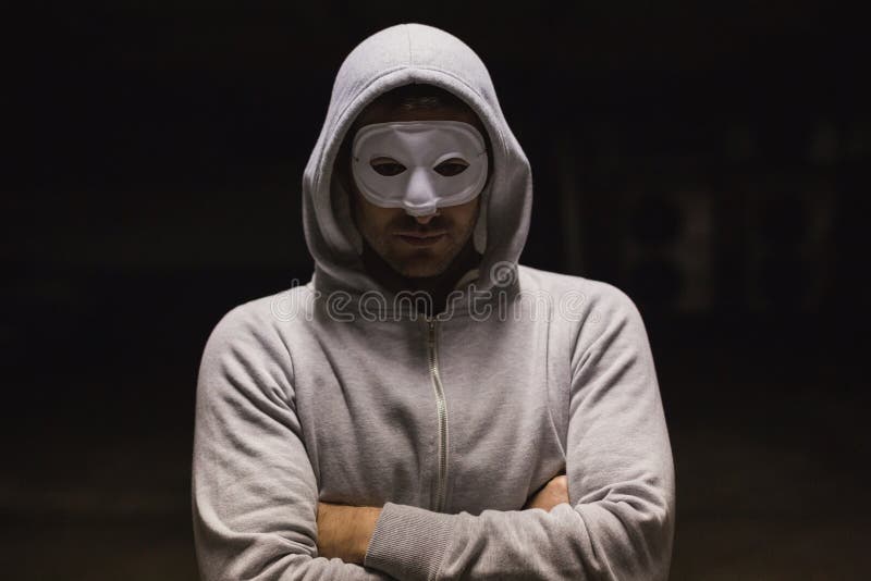 Criminal Mask and Cap. Footage. Close-up of Gangster Plastic White Mask ...