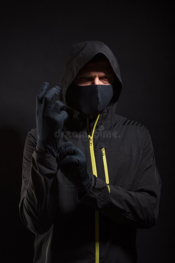 Criminal Man with a Mask Standing on a Street at Night Stock Photo ...