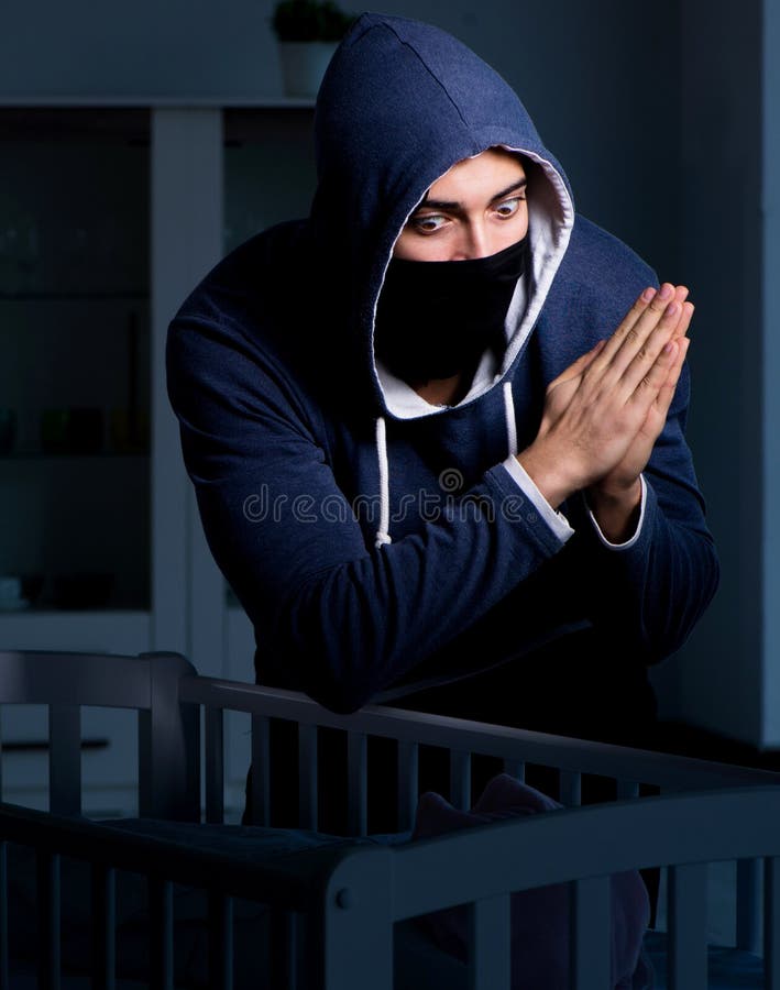 Criminal Stealing Baby in Human Child Traficking Concept Stock Photo ...