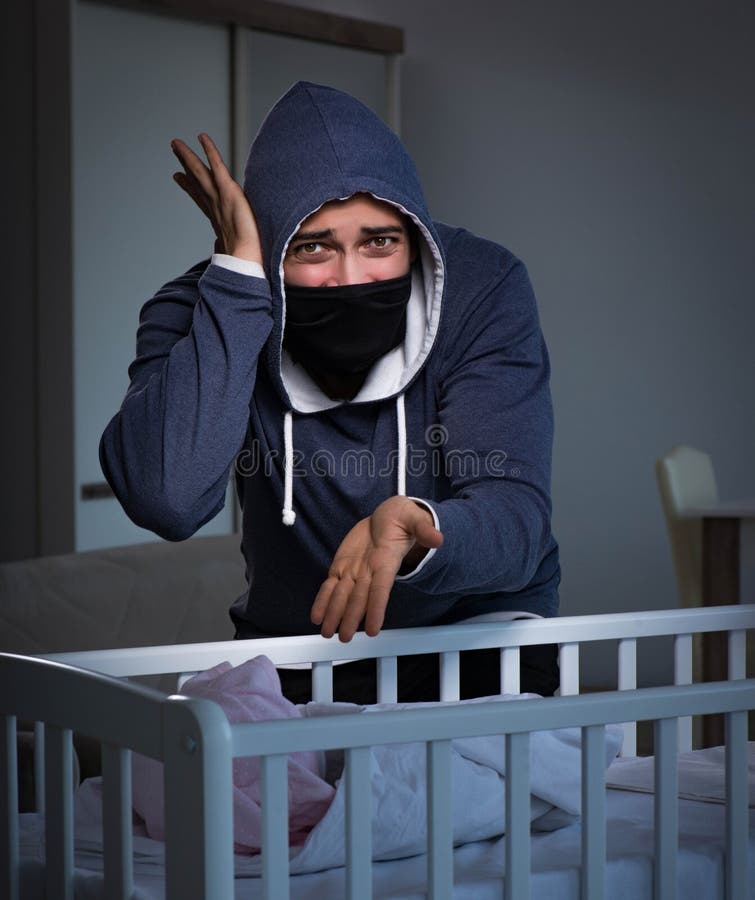 Criminal Stealing Baby in Human Child Traficking Concept Stock Image ...