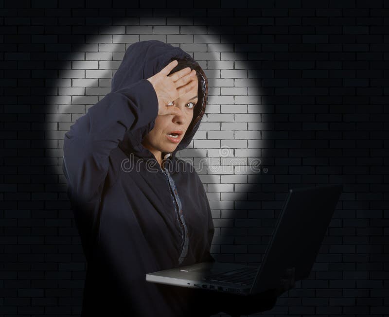 Criminal Woman Hacker Wearing Hood on Using a Laptop Catched Wit Stock ... Criminal Woman Hacker Wearing Hood on Using a Laptop Catched Wit Stock ...