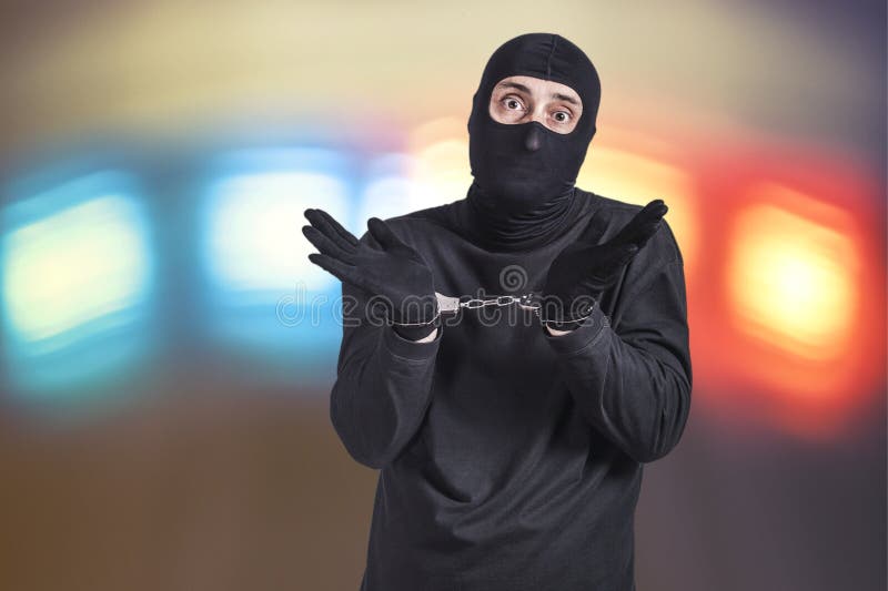 Criminel arrêté photo stock. Image du arrestation, masque - 84211660