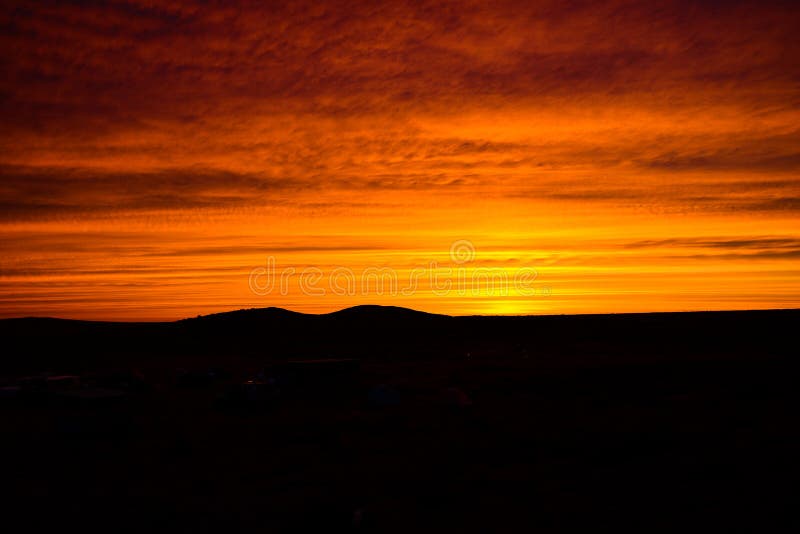 Crimson Sunset on a Beach Filled with Glowing Natural Colored Polish ...