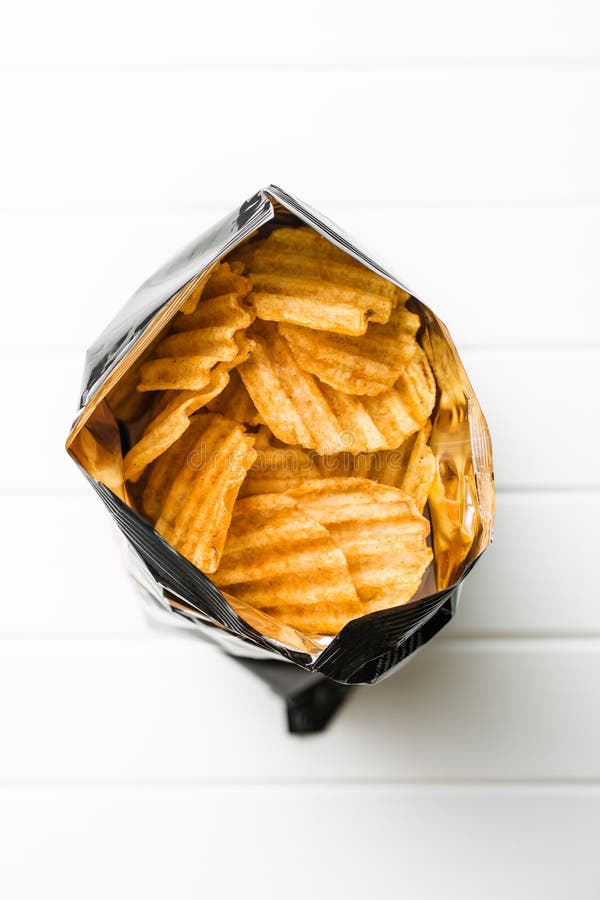 Crinkle cut potato chips. stock image. Image of pile - 72192971