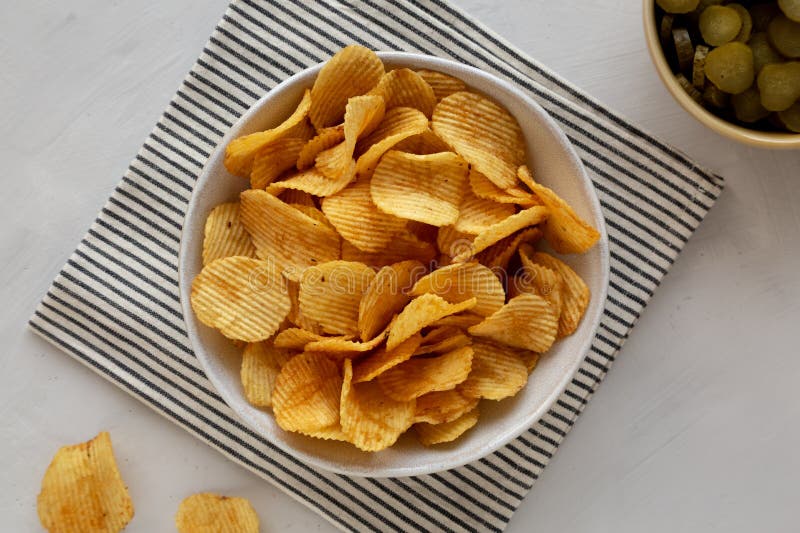 Crinkle Potato Chips and Green Pickle Chips in Bowls, Top View Stock ...