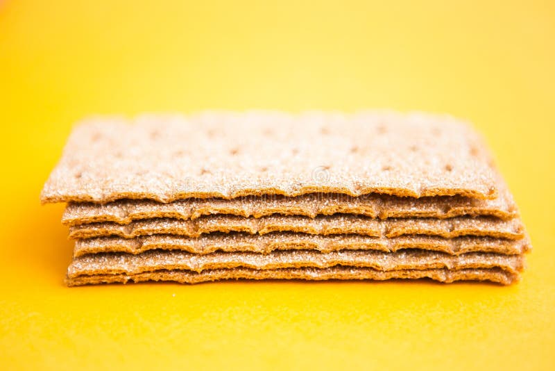 Crisp Bread on the Yellow Background. Corn Dodger. Crackers. Loaf of ...