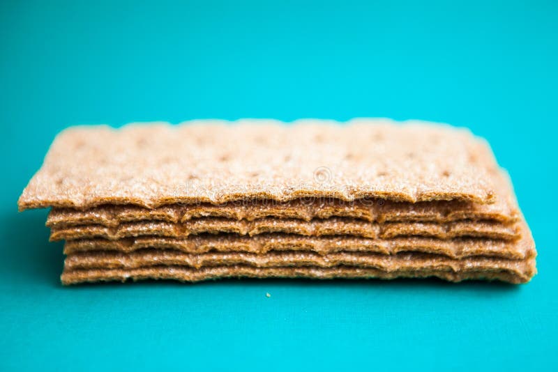 Crisp Bread on the Turquois Background. Corn Dodger. Crackers. Loaf of ...